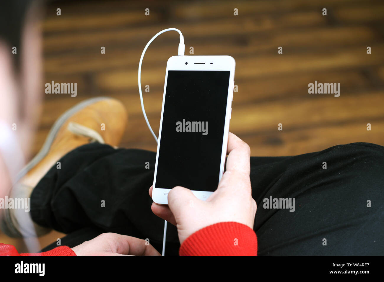 Picture of man holding a mobile in hand. Isolated on white background ...
