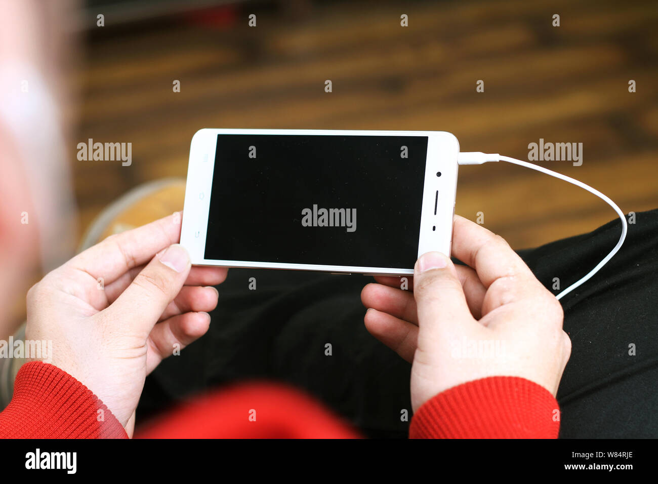 Picture of man holding a mobile in hand. Isolated on white background ...