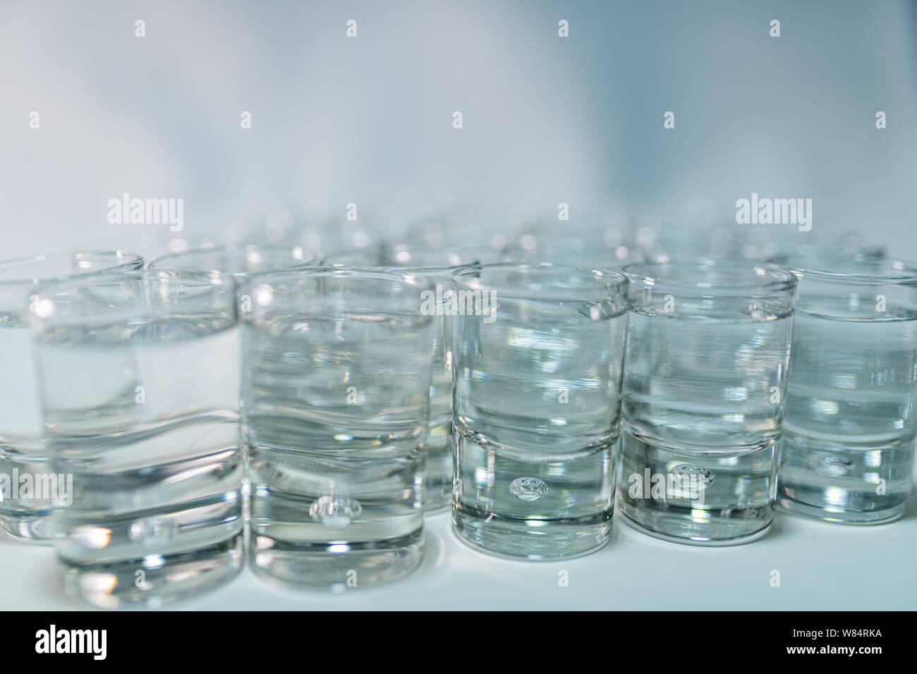 Close-up shots of a luxurious transparent tequila in a bar on a white ...