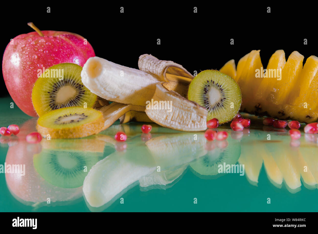 Delicious tropical snack - Banana, sliced kiwi, red apple and Hawaiian ...