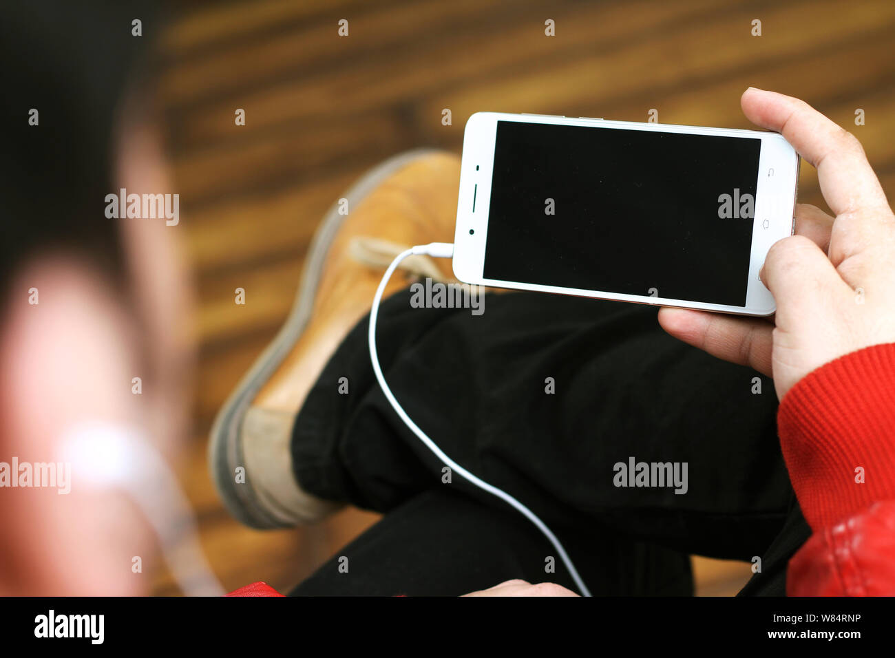 Picture of man holding a mobile in hand. Isolated on white background ...
