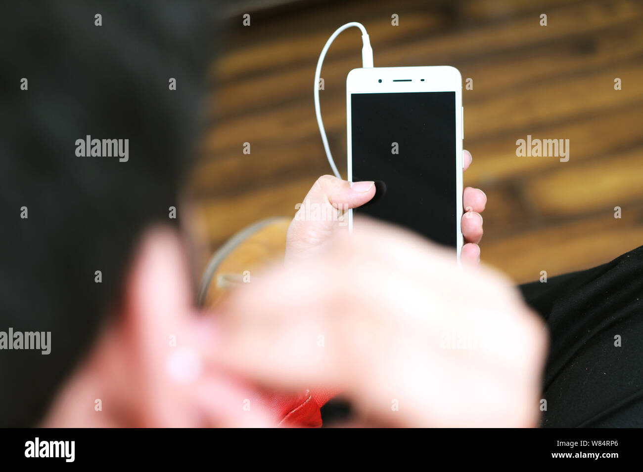 Picture of man holding a mobile in hand. Isolated on white background ...