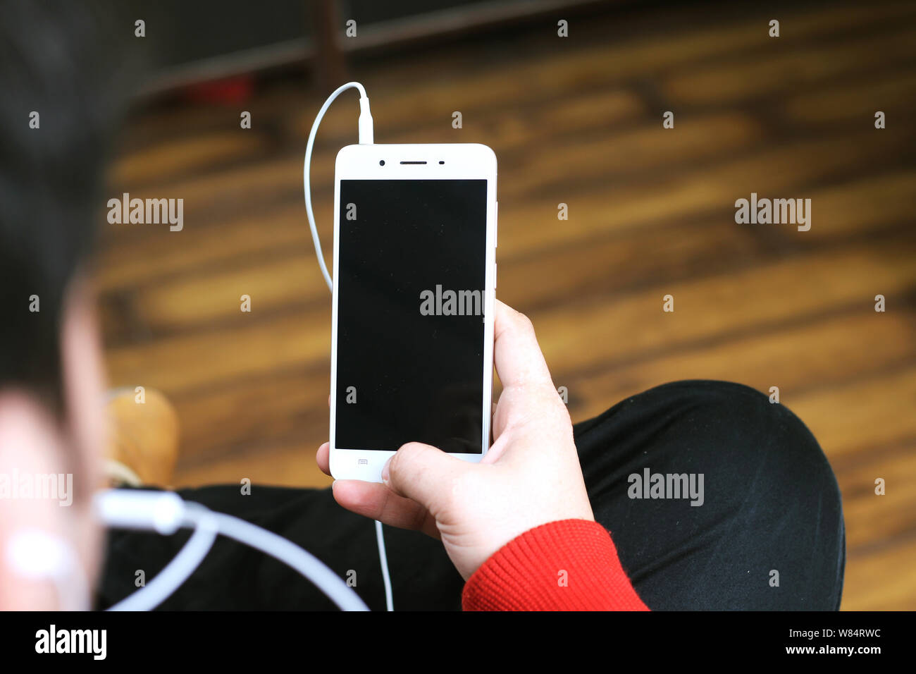 Picture of man holding a mobile in hand. Isolated on white background ...