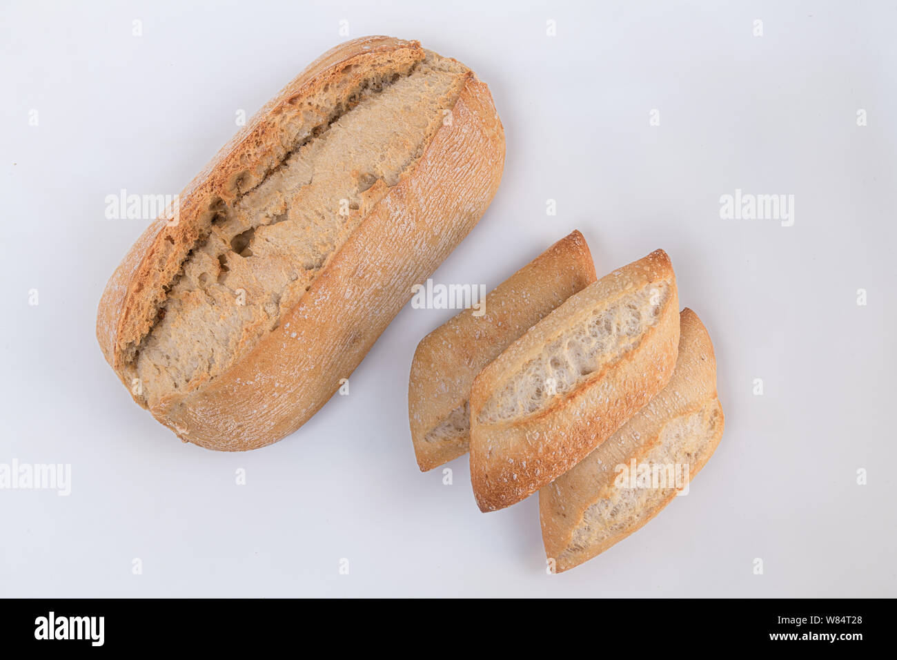 One big loaf of homemade Ciabatta Bread and three little pieces. top ...