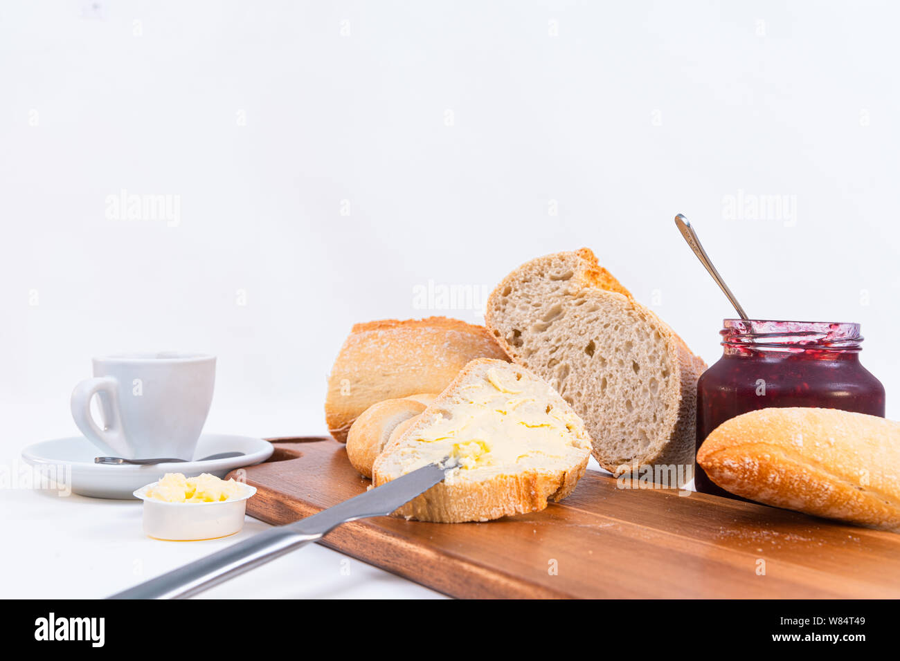 cereal bread slices with butter and jar with homemade jam closeup on ...