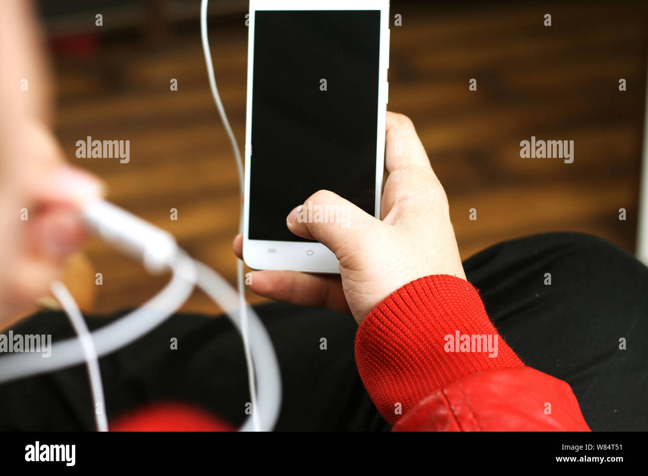 Picture of man holding a mobile in hand. Isolated on white background ...