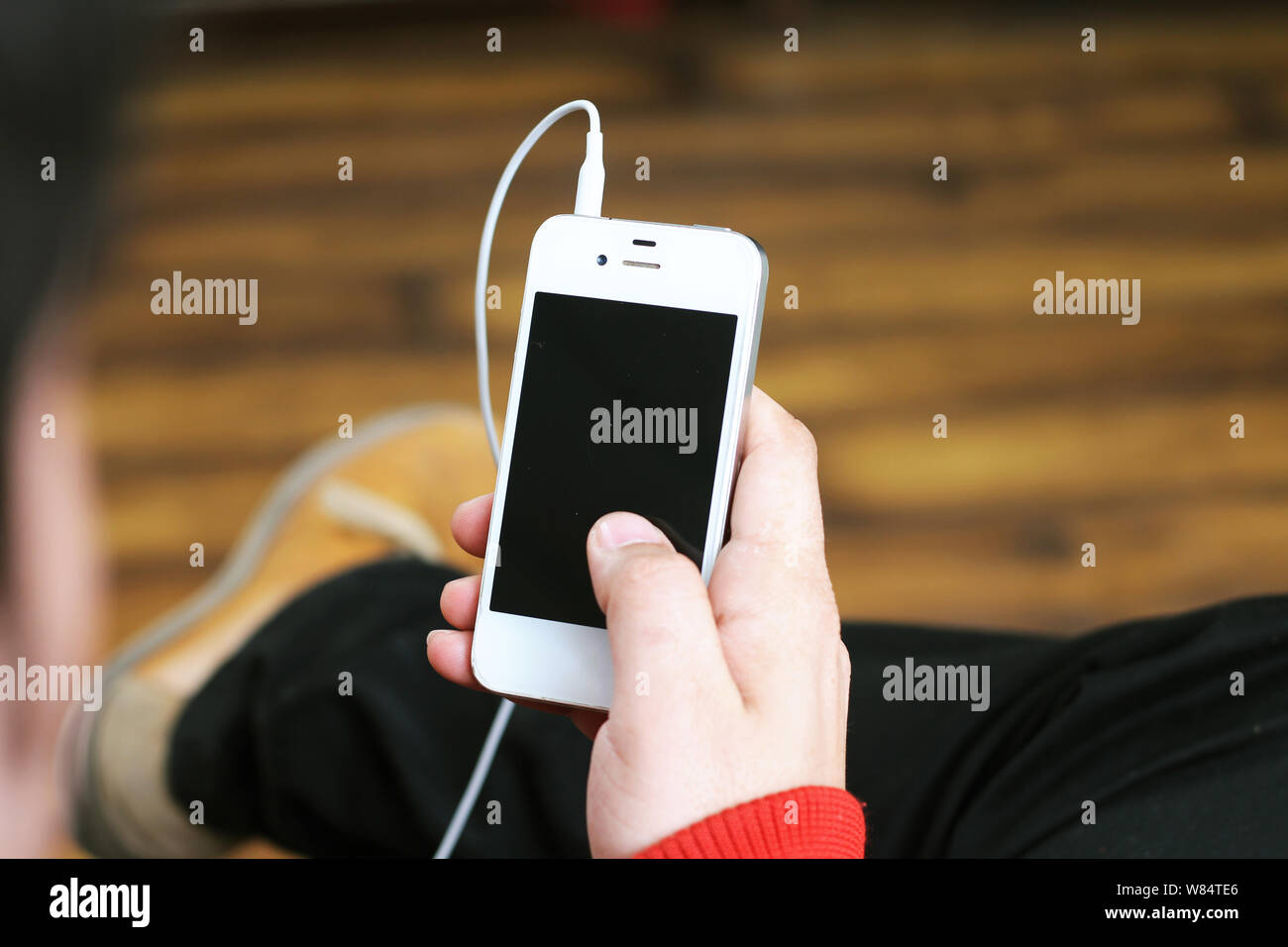 Picture of man holding a mobile in hand. Isolated on white background ...