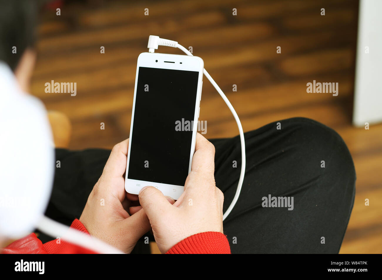 Picture of man holding a mobile in hand. Isolated on white background ...