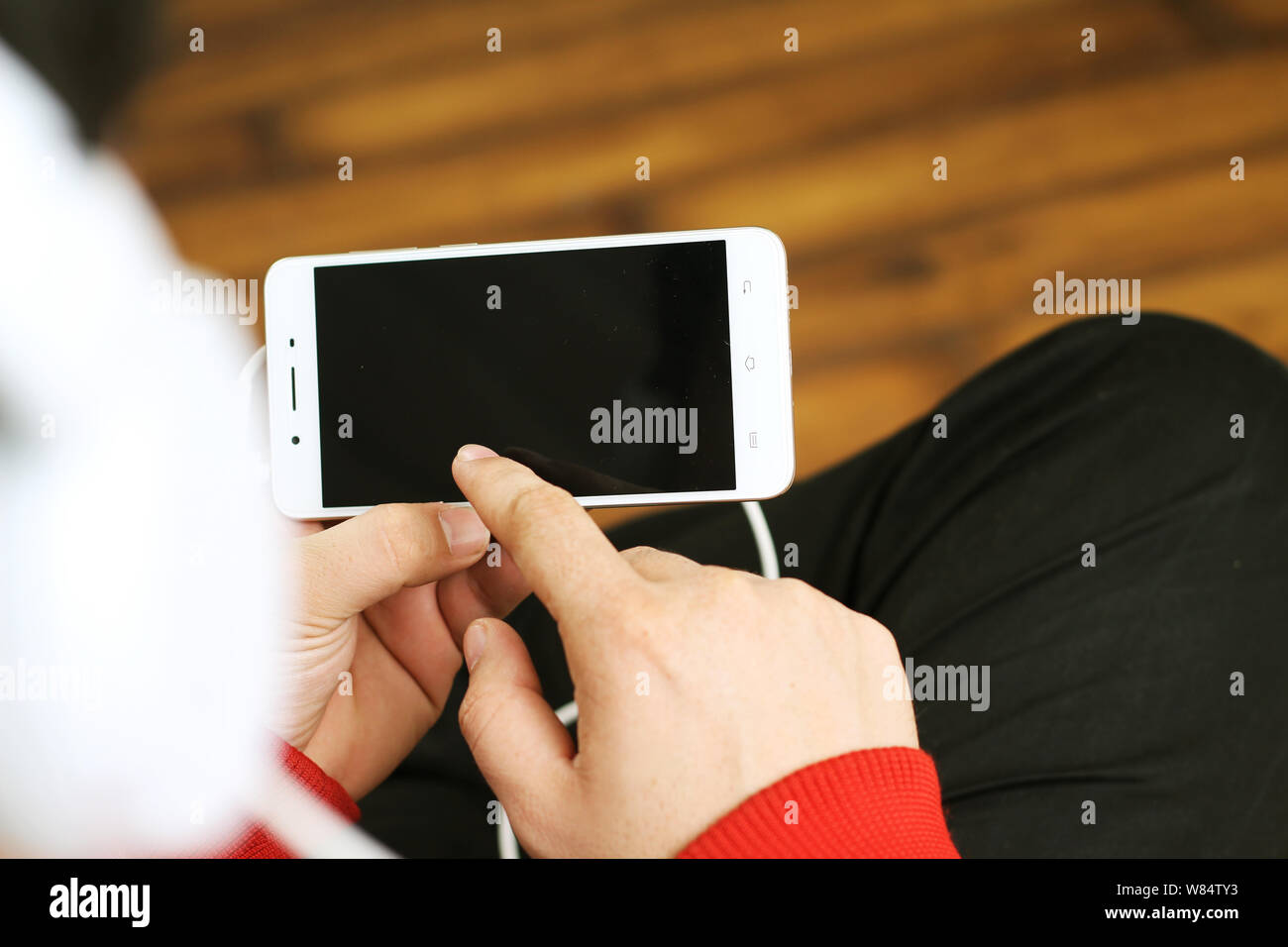 Picture of man holding a mobile in hand. Isolated on white background ...