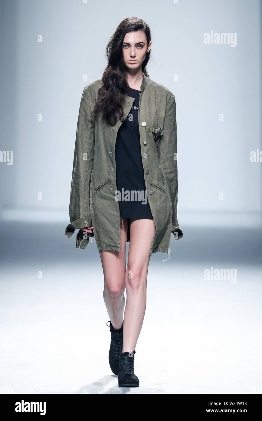 A model displays a new creation at the fashion show of Yaki Hidomi ...