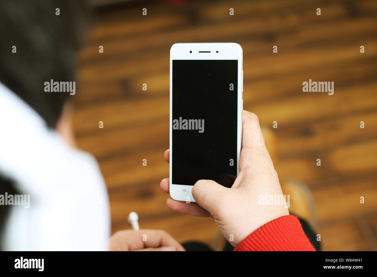 Picture of man holding a mobile in hand. Isolated on white background ...