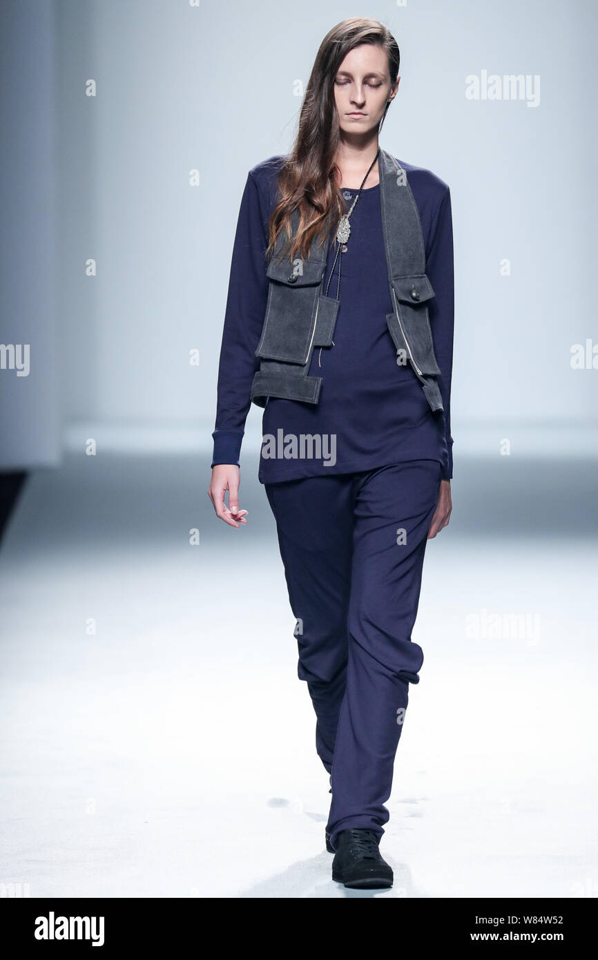 A model displays a new creation at the fashion show of Yaki Hidomi ...