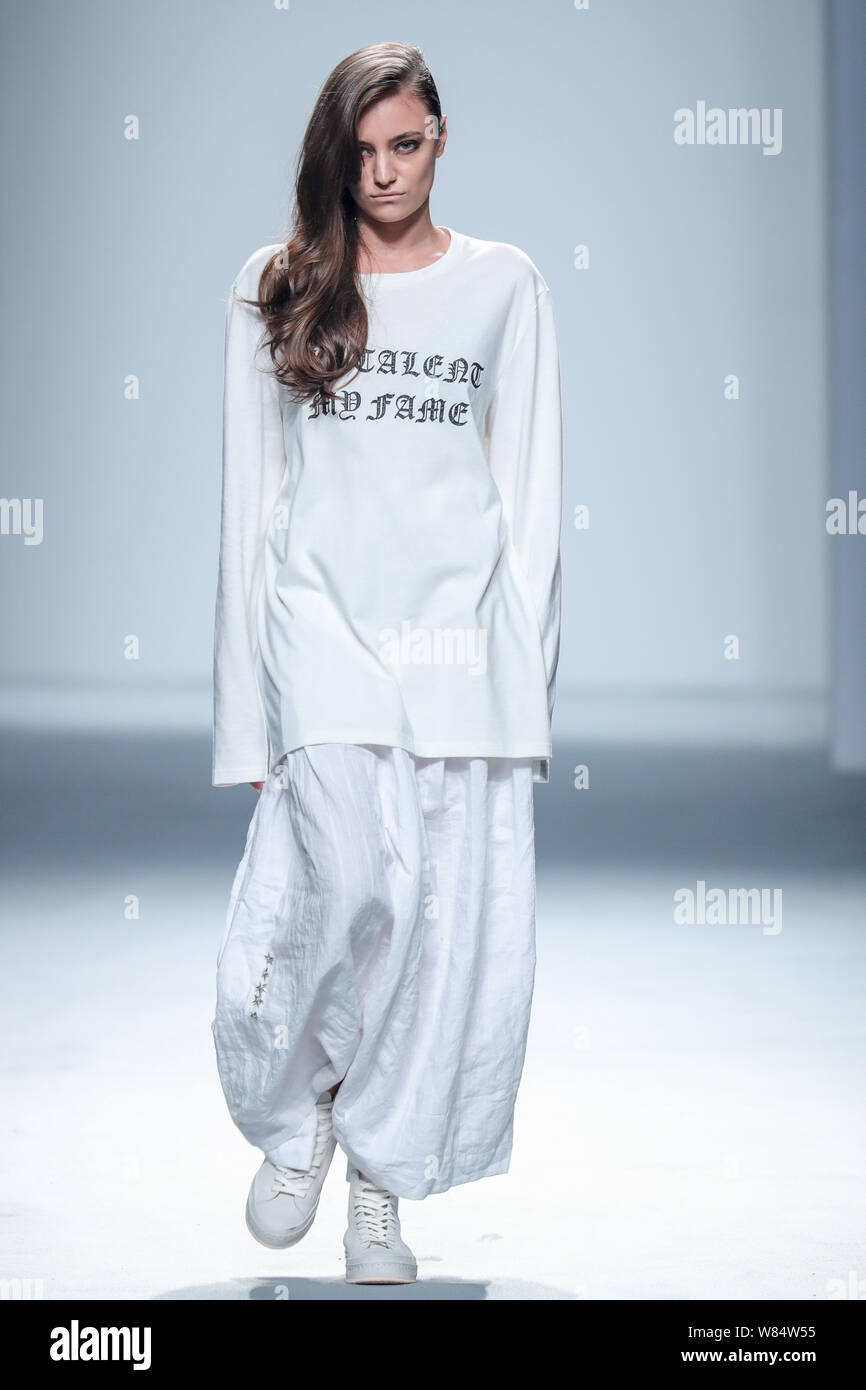 A model displays a new creation at the fashion show of Yaki Hidomi ...
