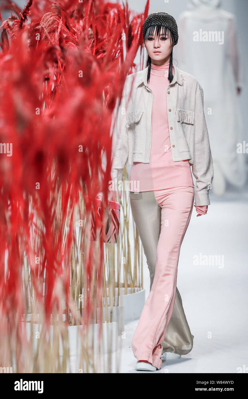 A model displays a new creation at the fashion show of Ji Cheng during ...