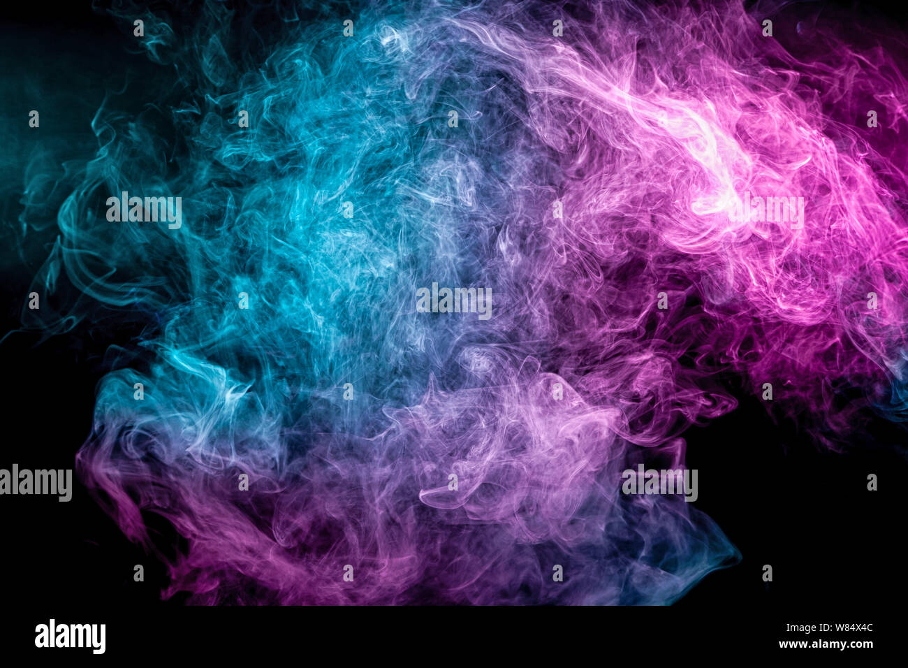 Colorful pink and blue smoke on a black isolated background. Background ...