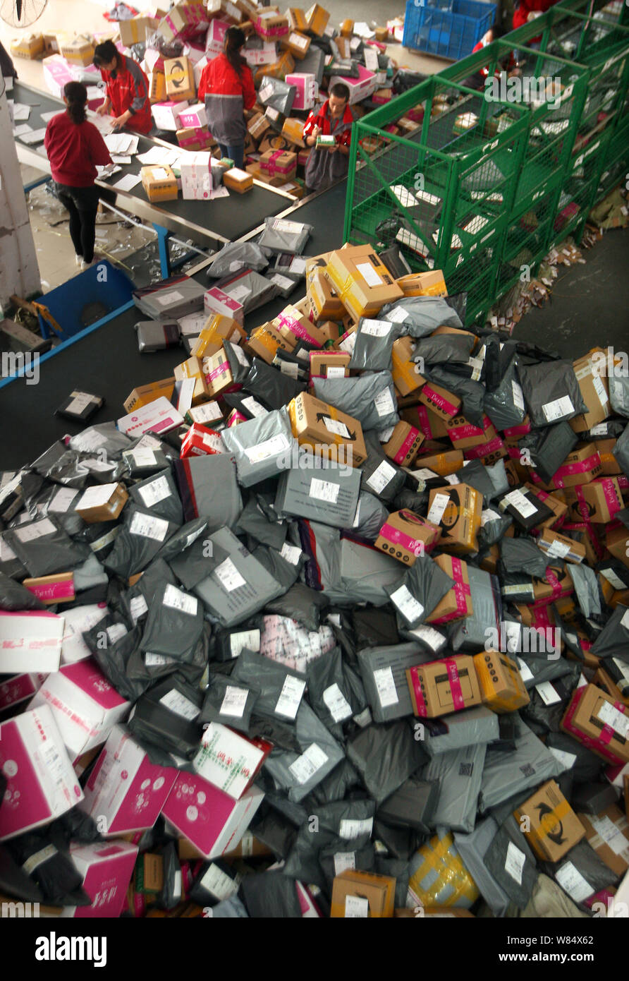 --FILE--Chinese workers sort parcels, most of which are from online ...