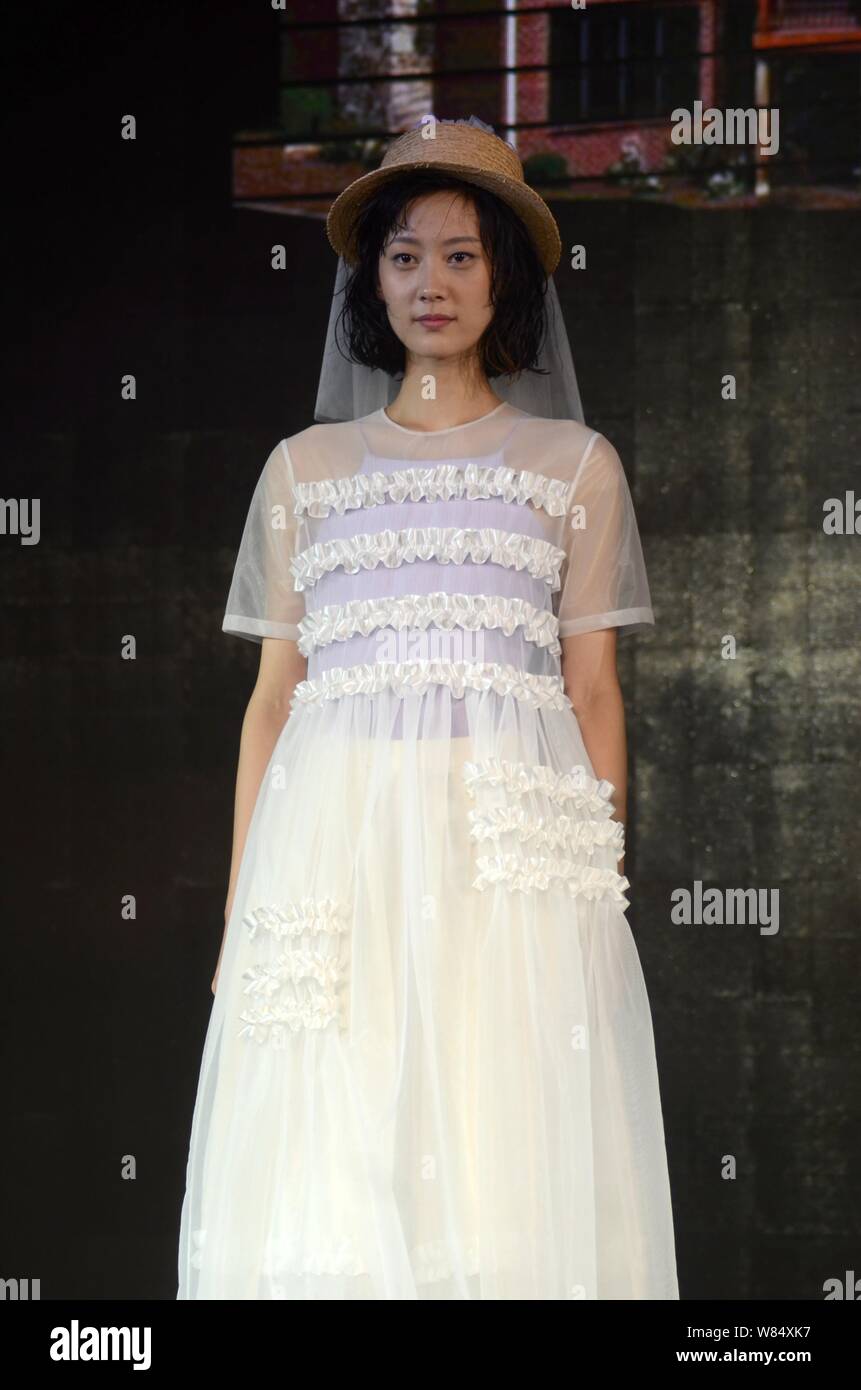 A model displays a new creation at a fashion show of Museum of ...