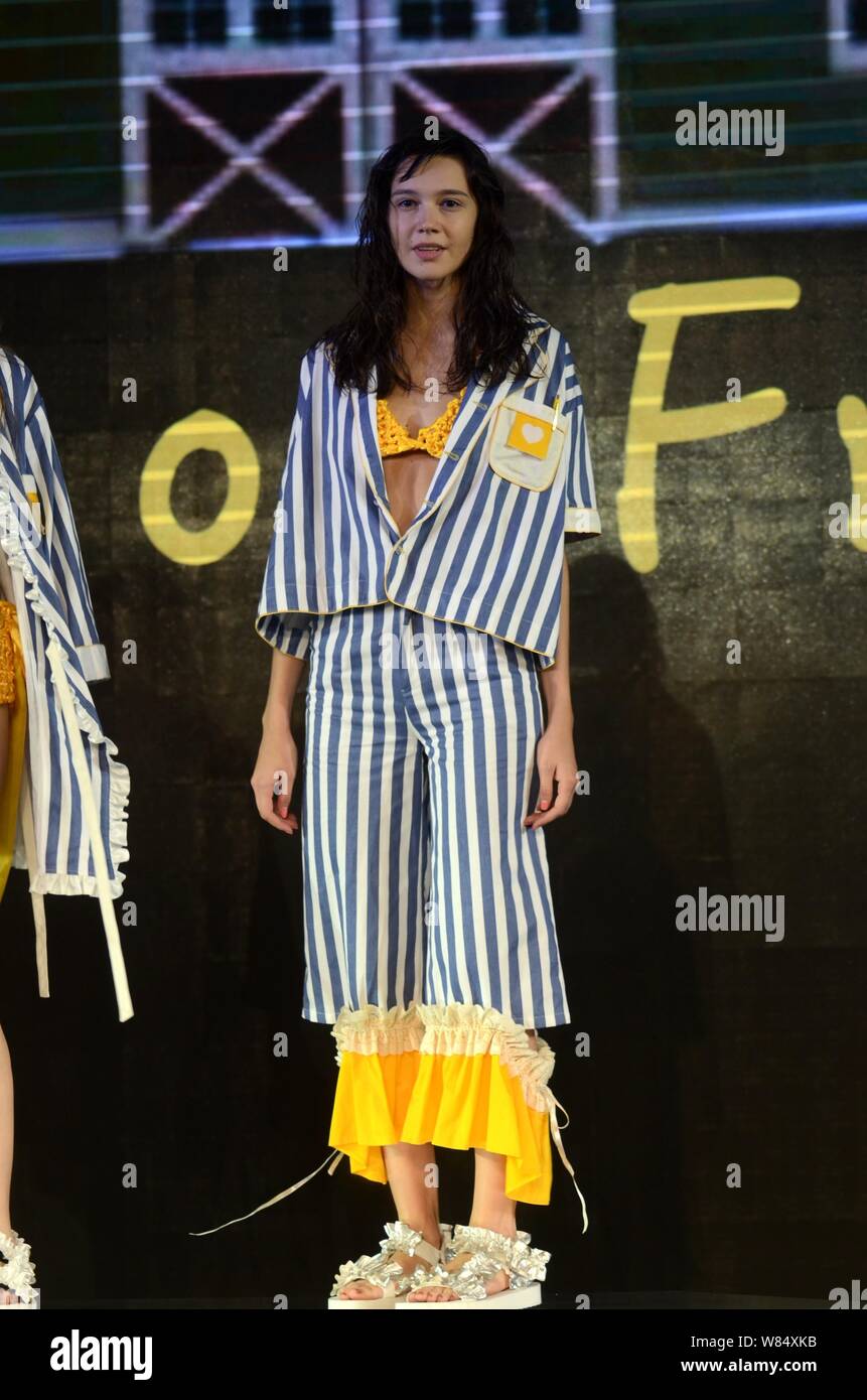 A model displays a new creation at a fashion show of Museum of ...