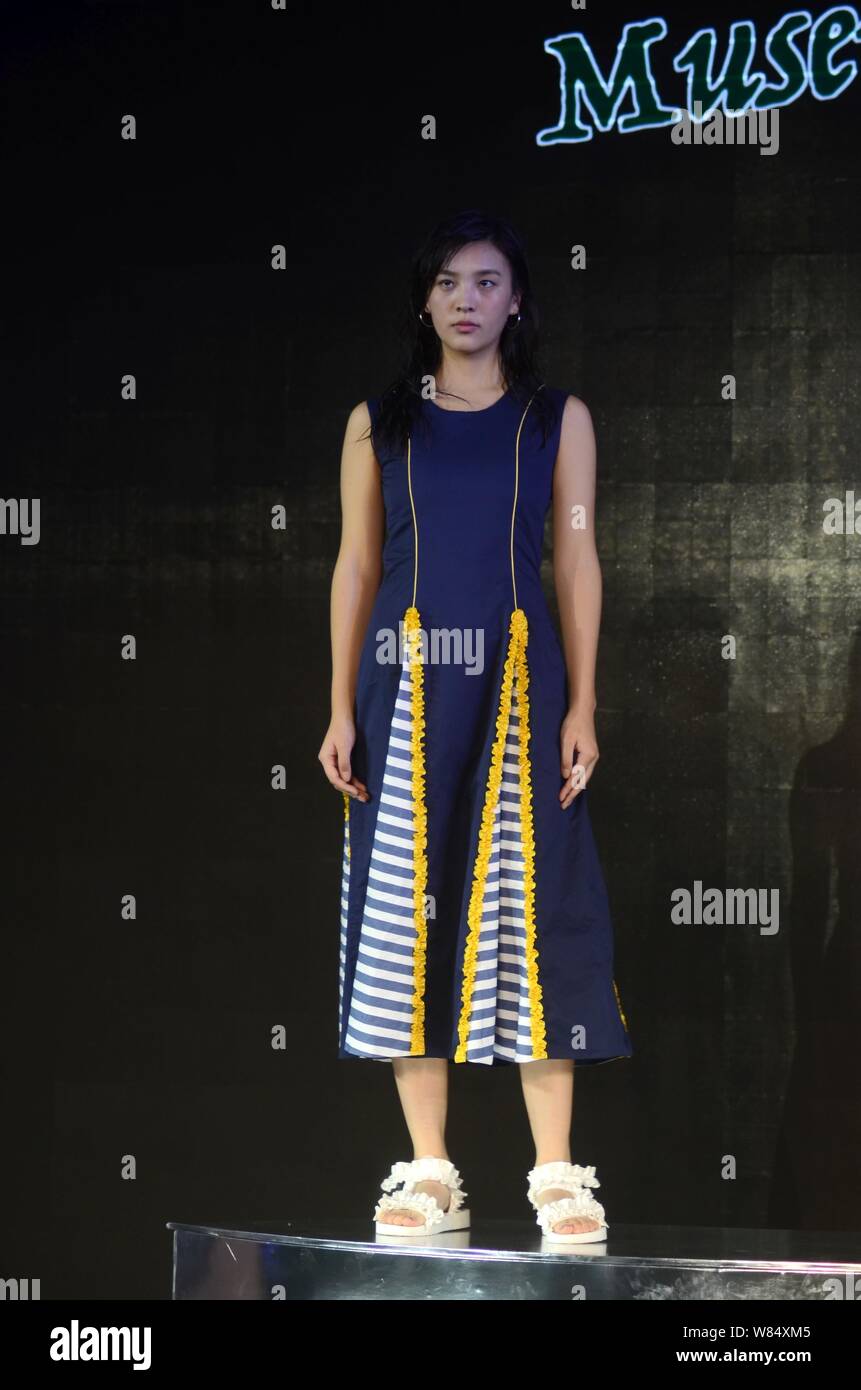 A model displays a new creation at a fashion show of Museum of ...