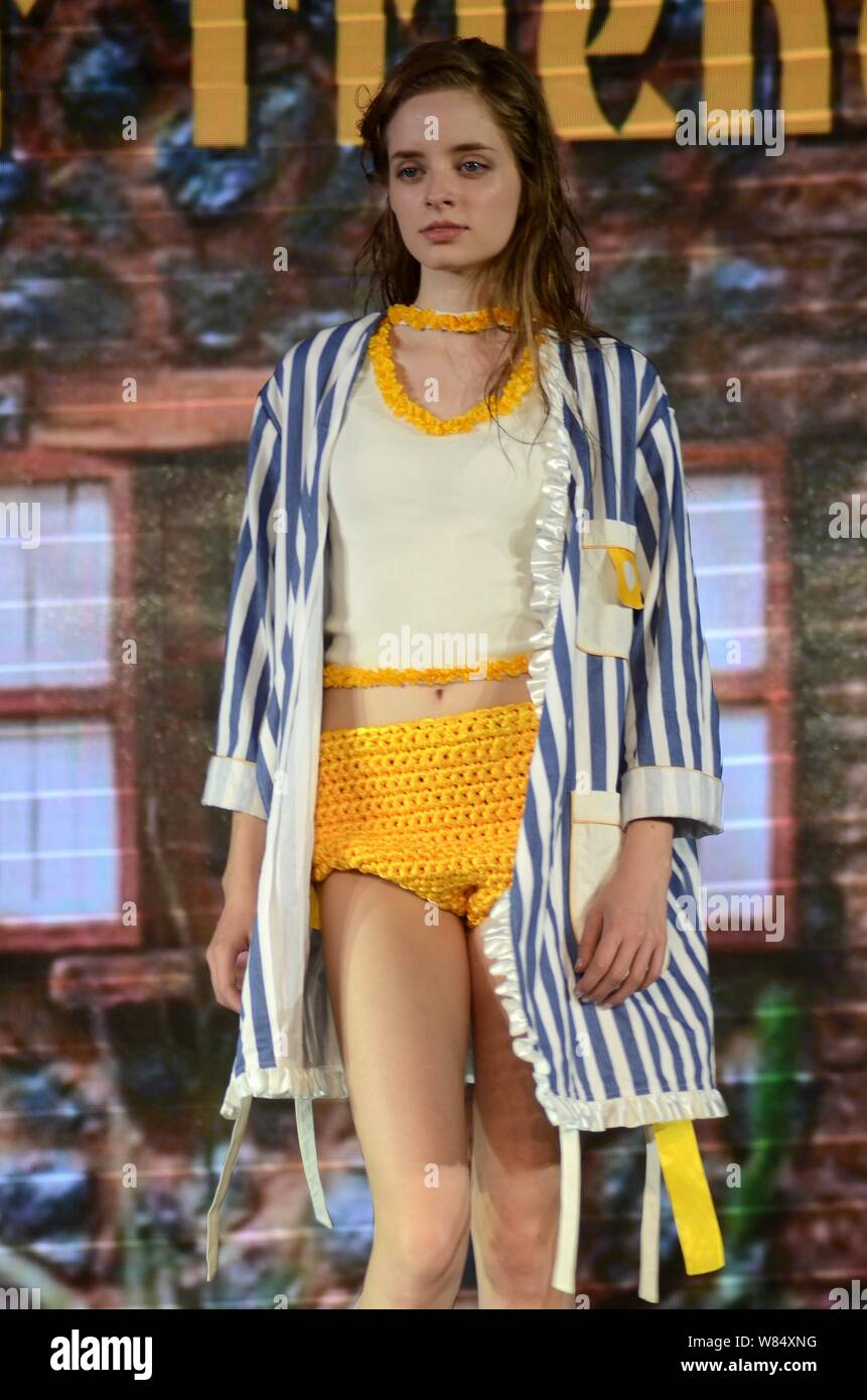 A model displays a new creation at a fashion show of Museum of ...