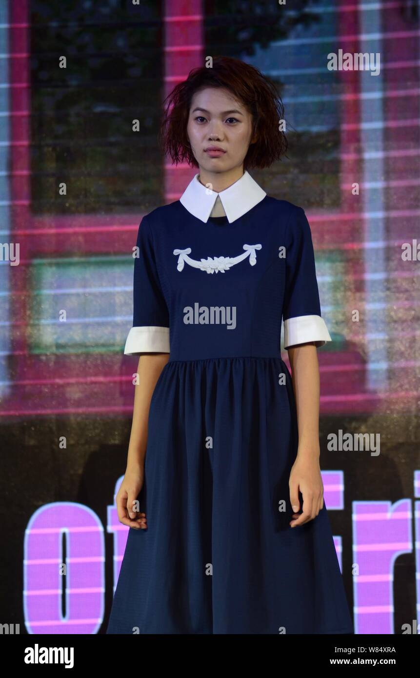 A model displays a new creation at a fashion show of Museum of ...