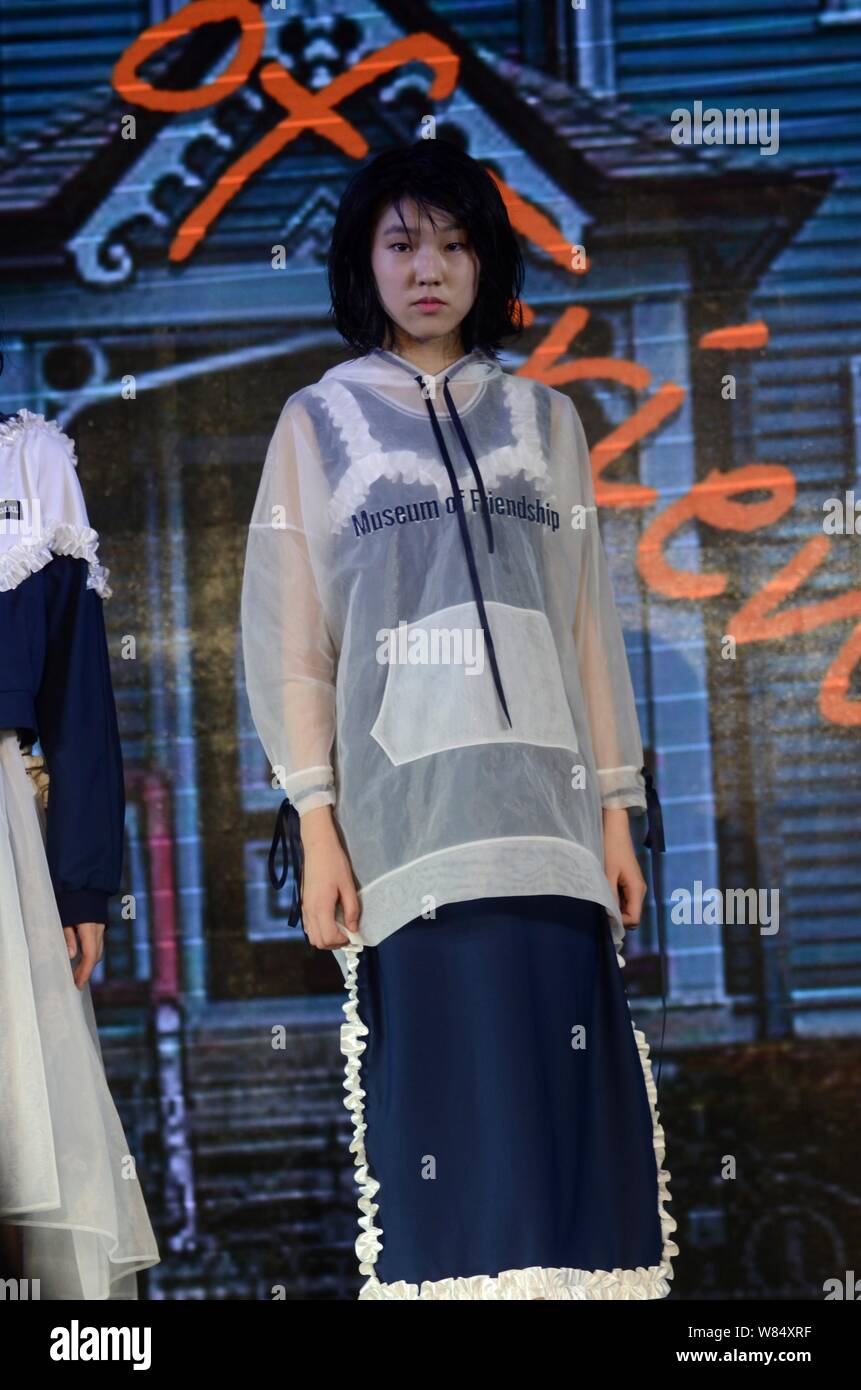 A model displays a new creation at a fashion show of Museum of ...