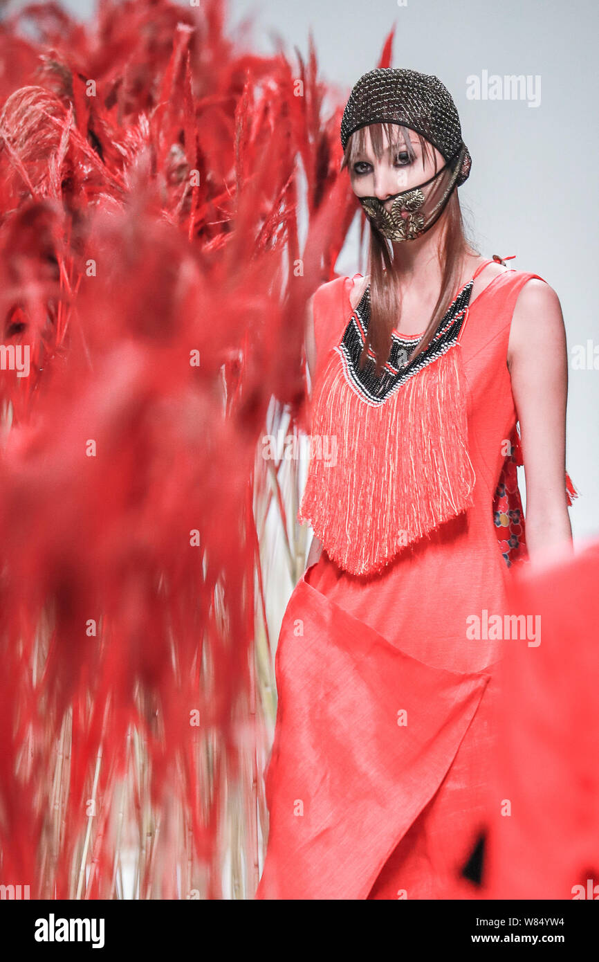 A model displays a new creation at the fashion show of Ji Cheng during ...