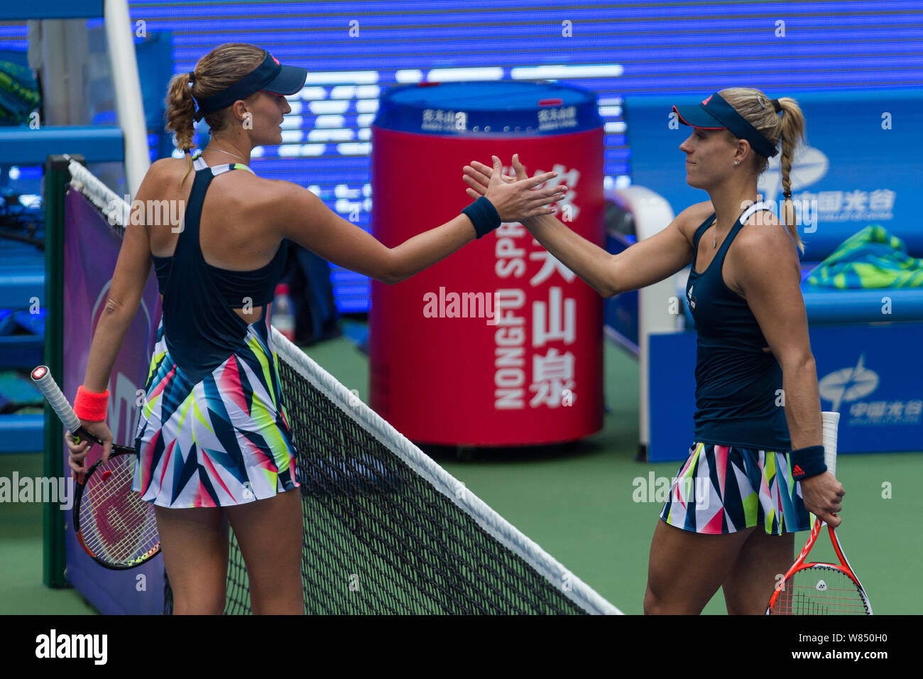 Angelique Kerber of Germany, right, interacts with Kristina Mladenovic ...