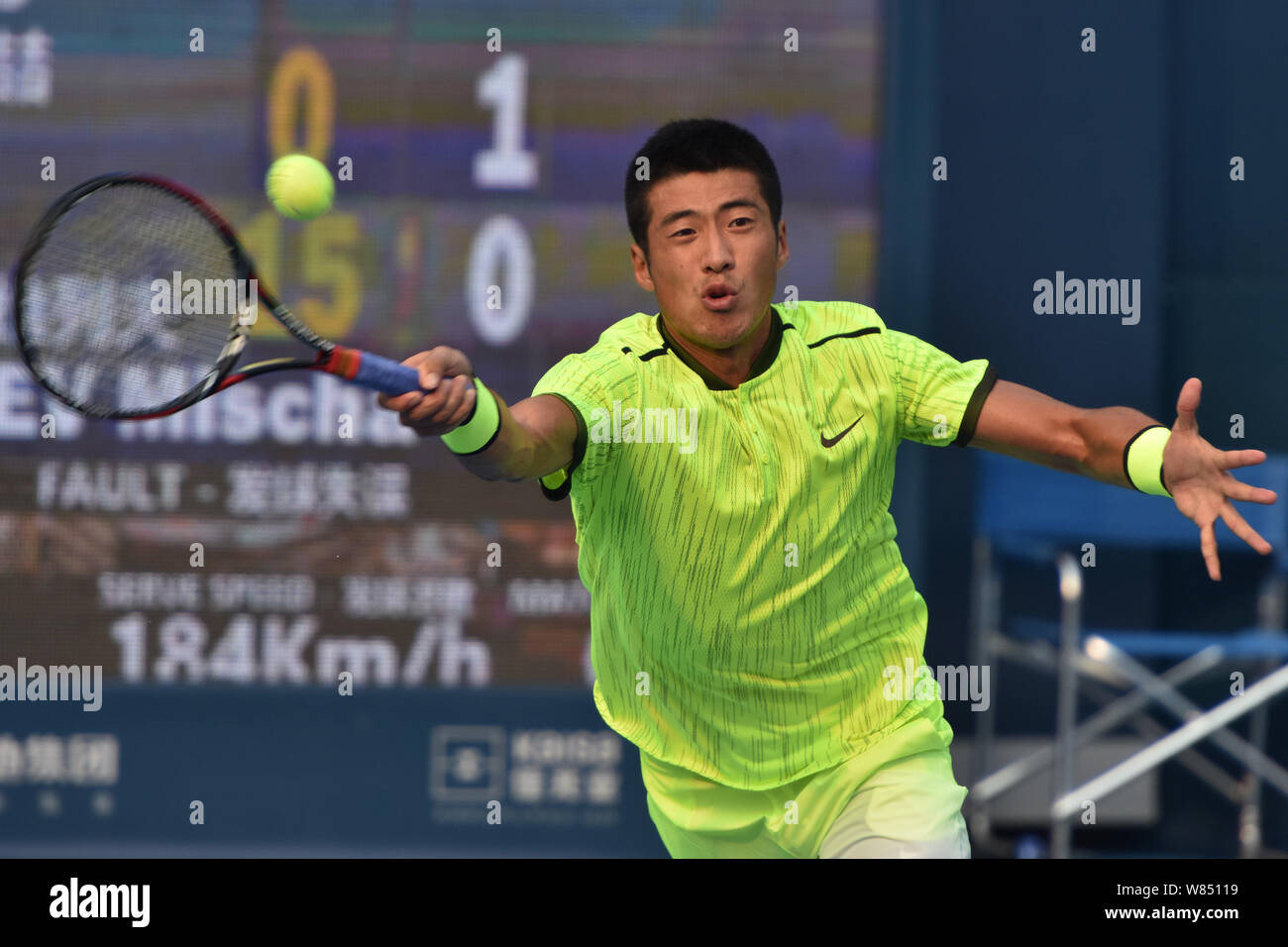 Li Zhe of China returns a shot to Mischa Zverev of Germany in their ...