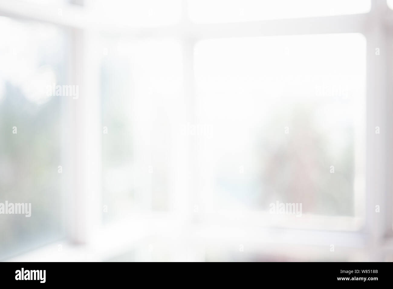 Blur background of white window glass and sky view from garden. Using ...