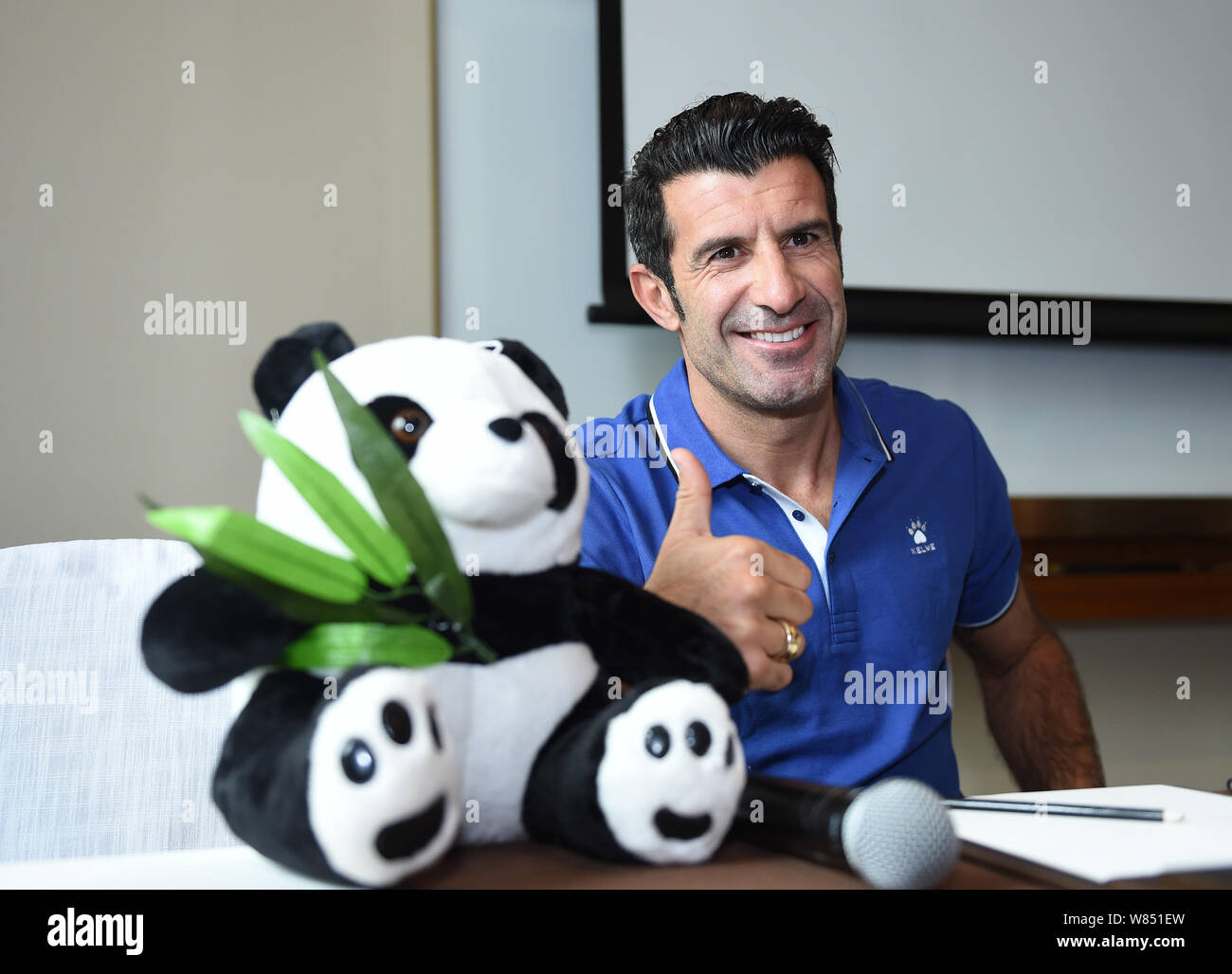 Portuguese football star Luis Figo attends a press conference for a ...