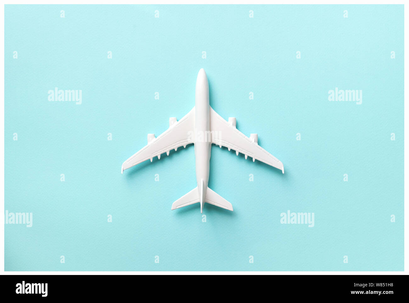 Top view of white model plane, airplane toy on pink pastel background ...