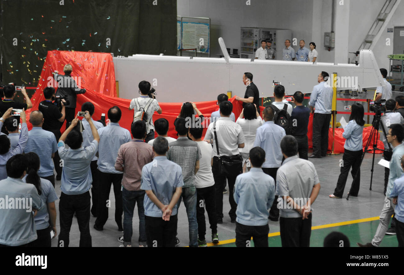 Officials unveil the first rudder during the delivery ceremony of the ...