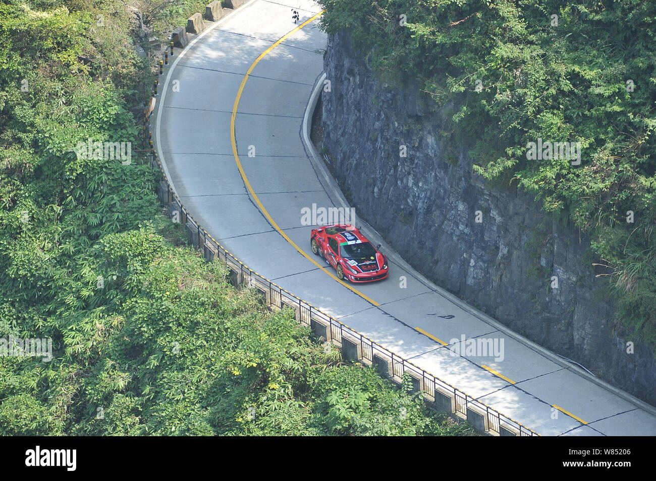 Italian racer Fabio Barone drives a Ferrari sports car on the Tongtian ...