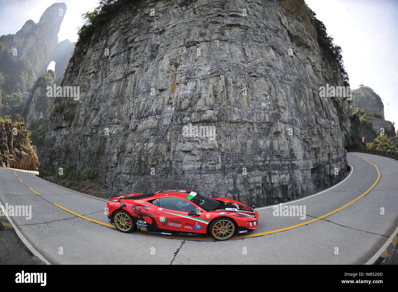 Italian racer Fabio Barone drives a Ferrari sports car on the Tongtian ...
