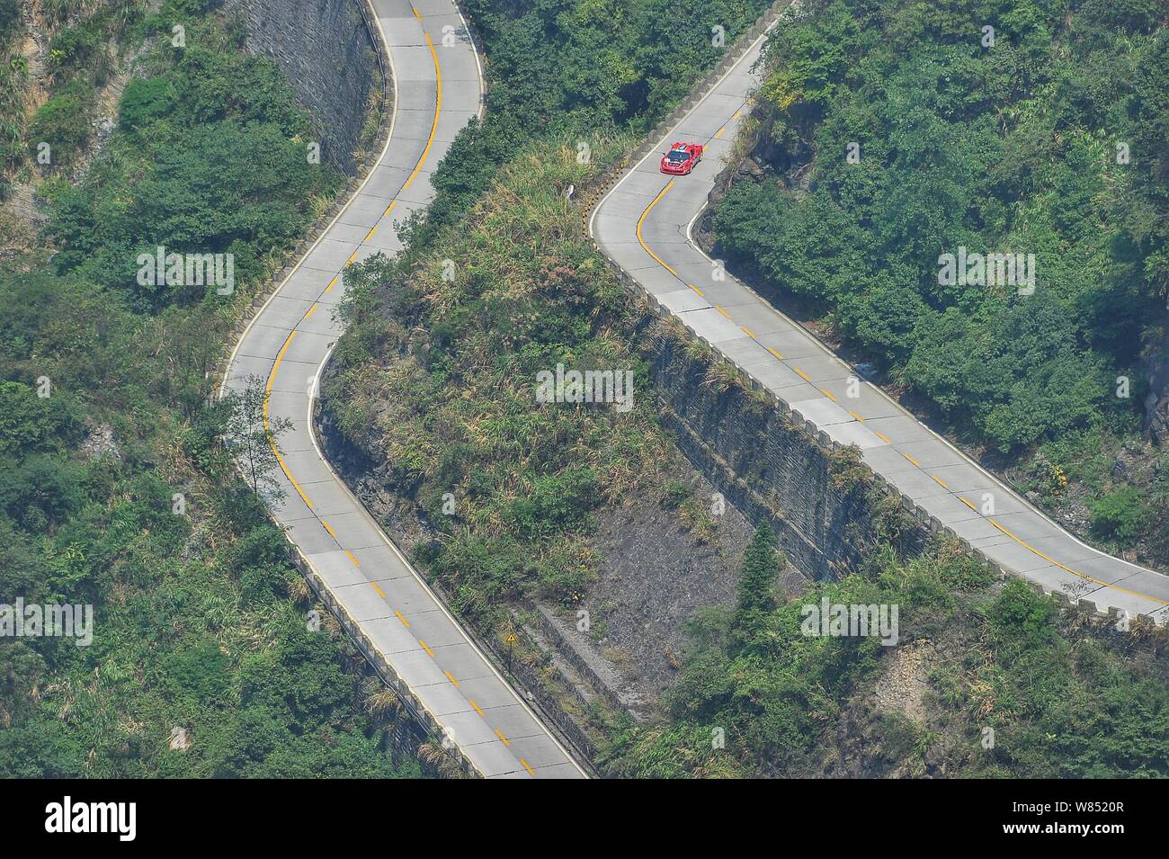 Italian racer Fabio Barone drives a Ferrari sports car on the Tongtian ...
