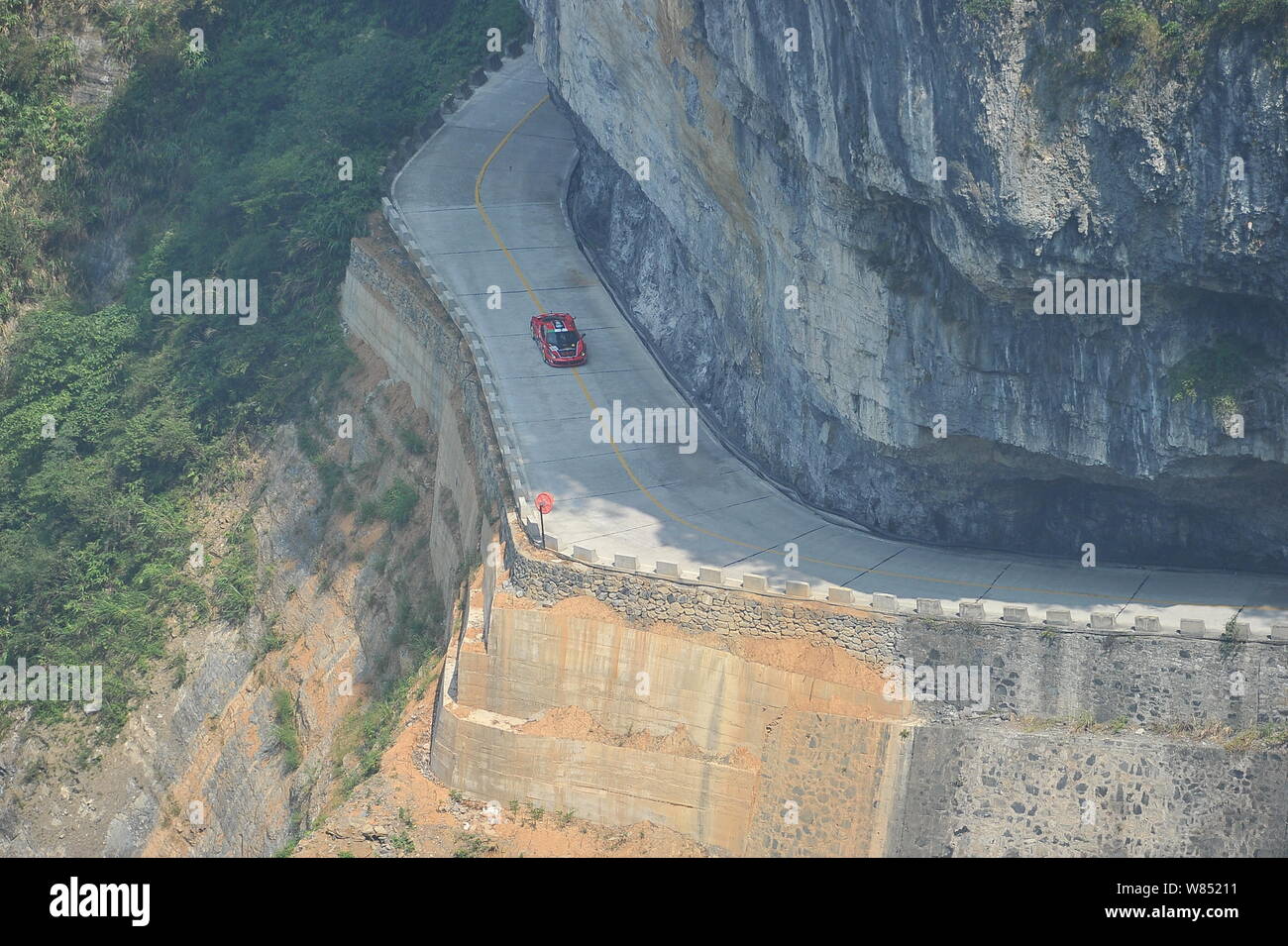 Italian racer Fabio Barone drives a Ferrari sports car on the Tongtian ...