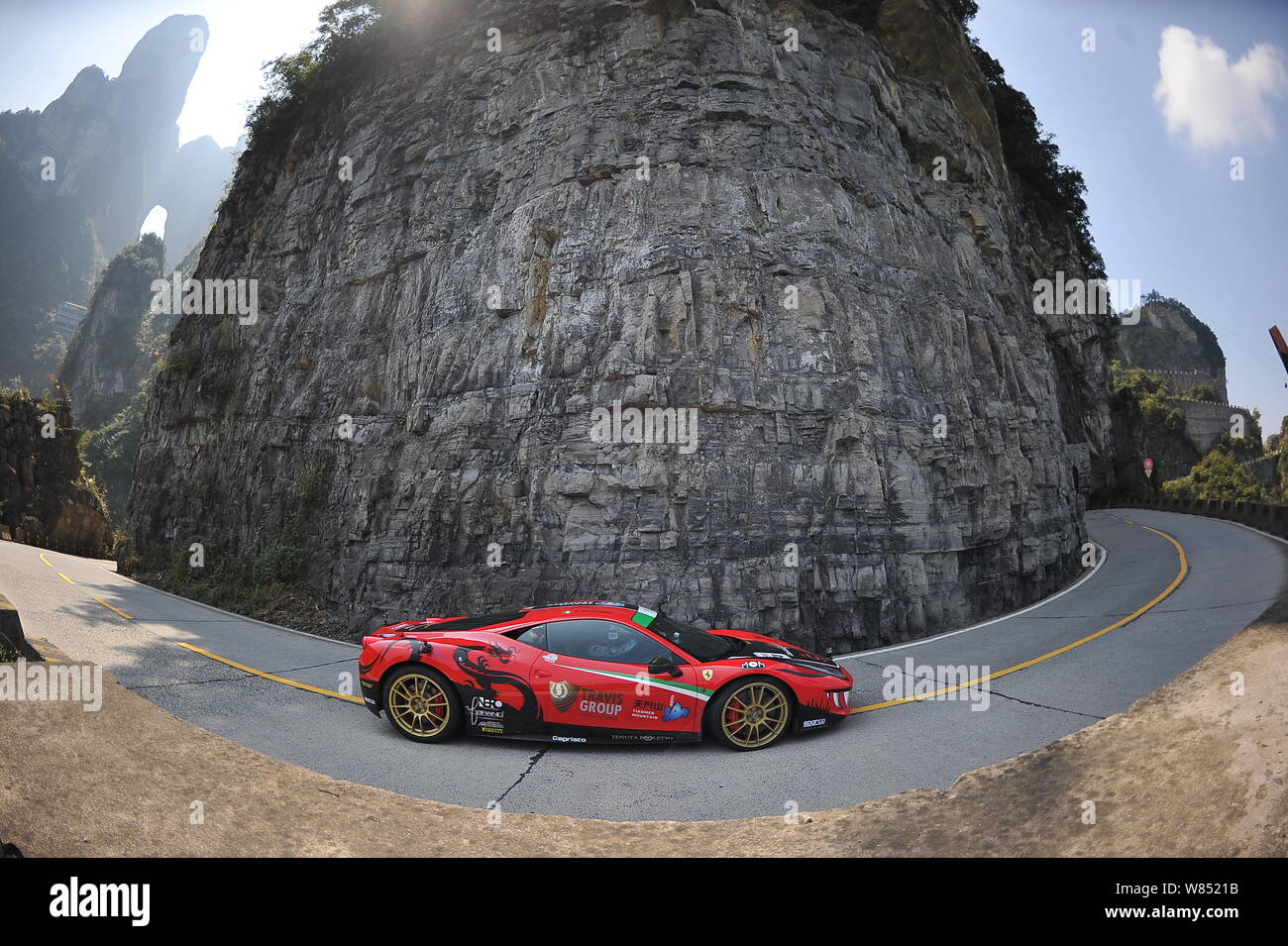 Italian racer Fabio Barone drives a Ferrari sports car on the Tongtian ...