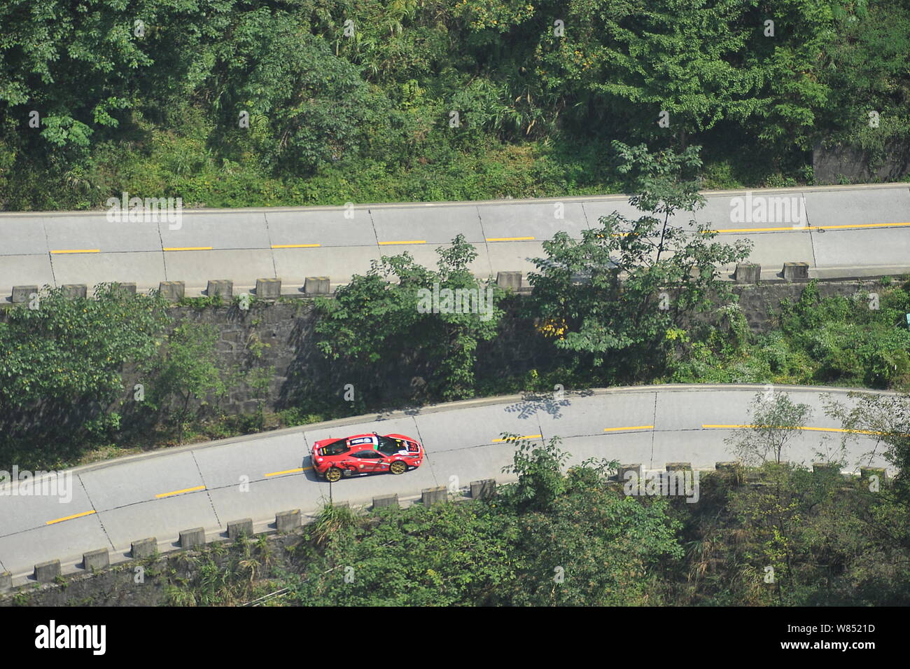Italian racer Fabio Barone drives a Ferrari sports car on the Tongtian ...
