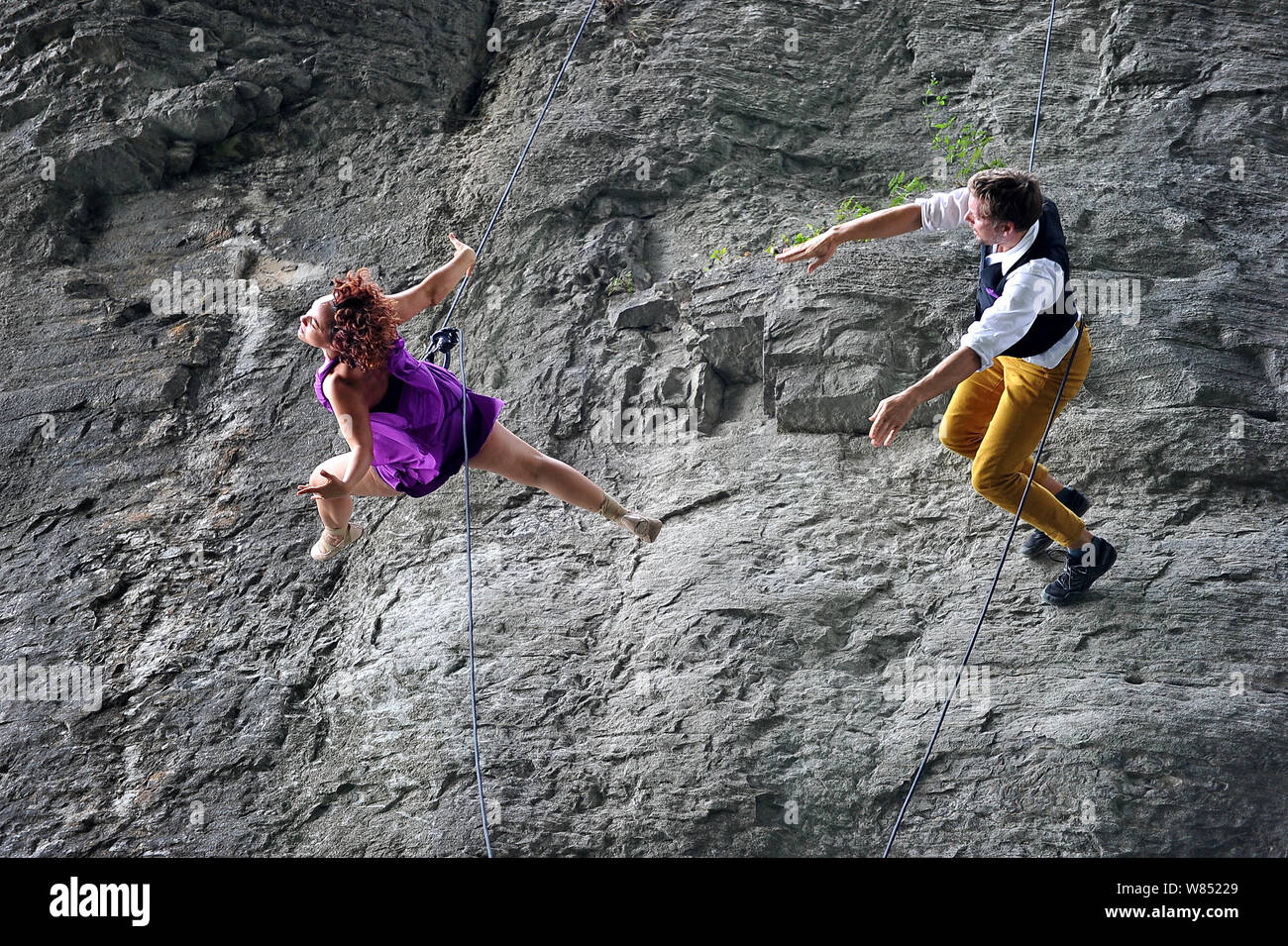 Dancers from American dance troupe Bandaloop perform as they were ...