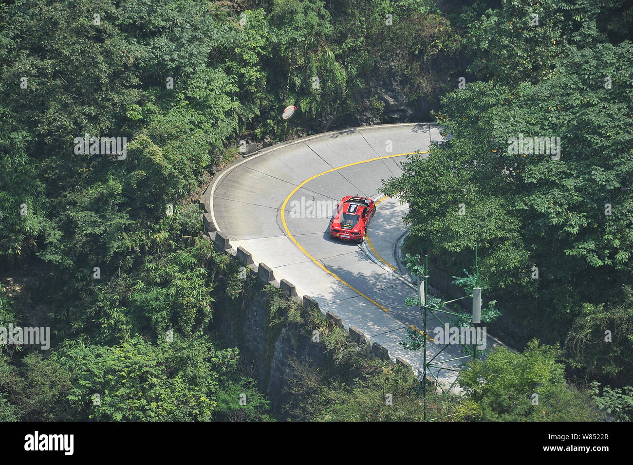 Italian racer Fabio Barone drives a Ferrari sports car on the Tongtian ...
