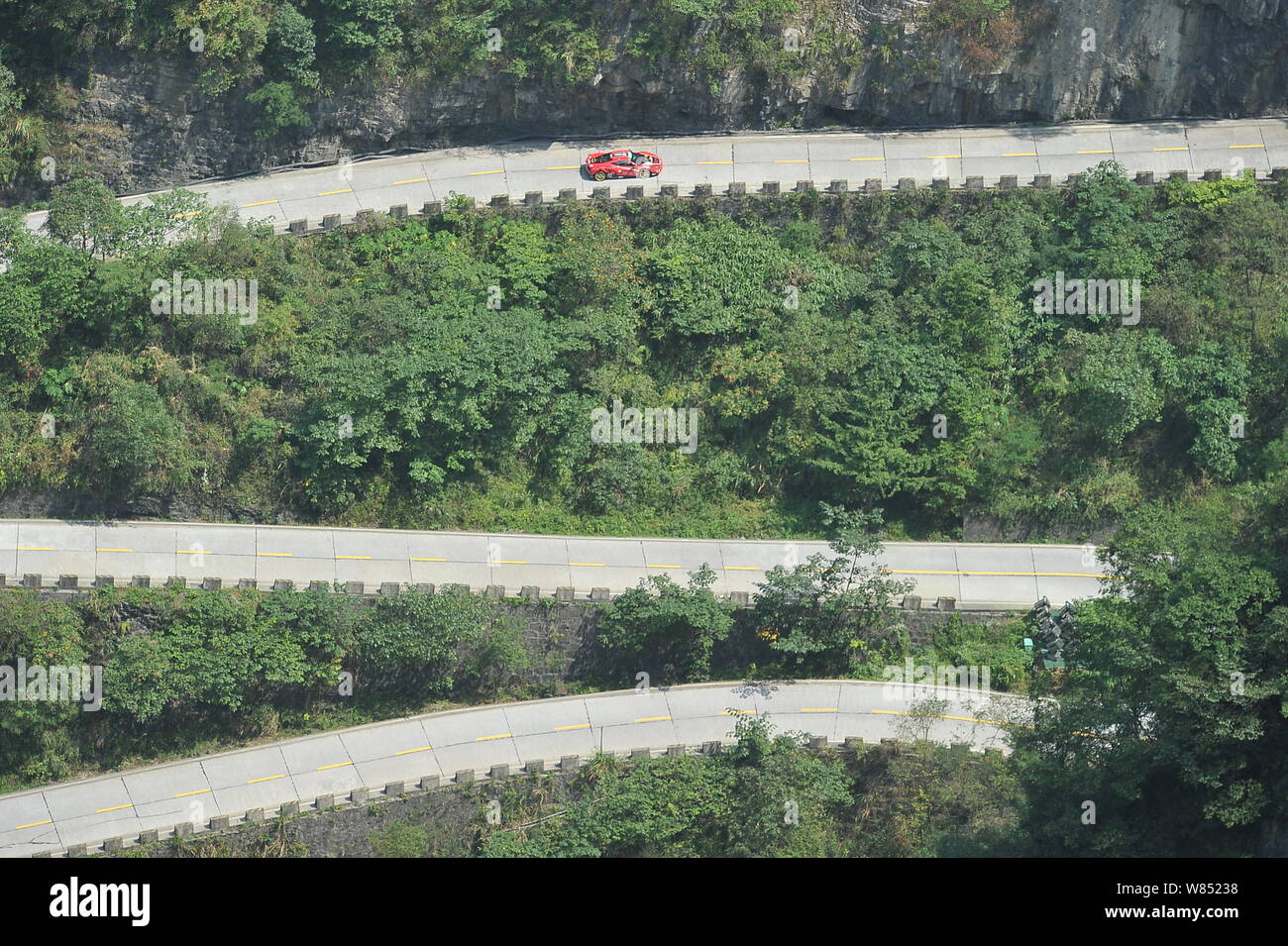 Italian racer Fabio Barone drives a Ferrari sports car on the Tongtian ...