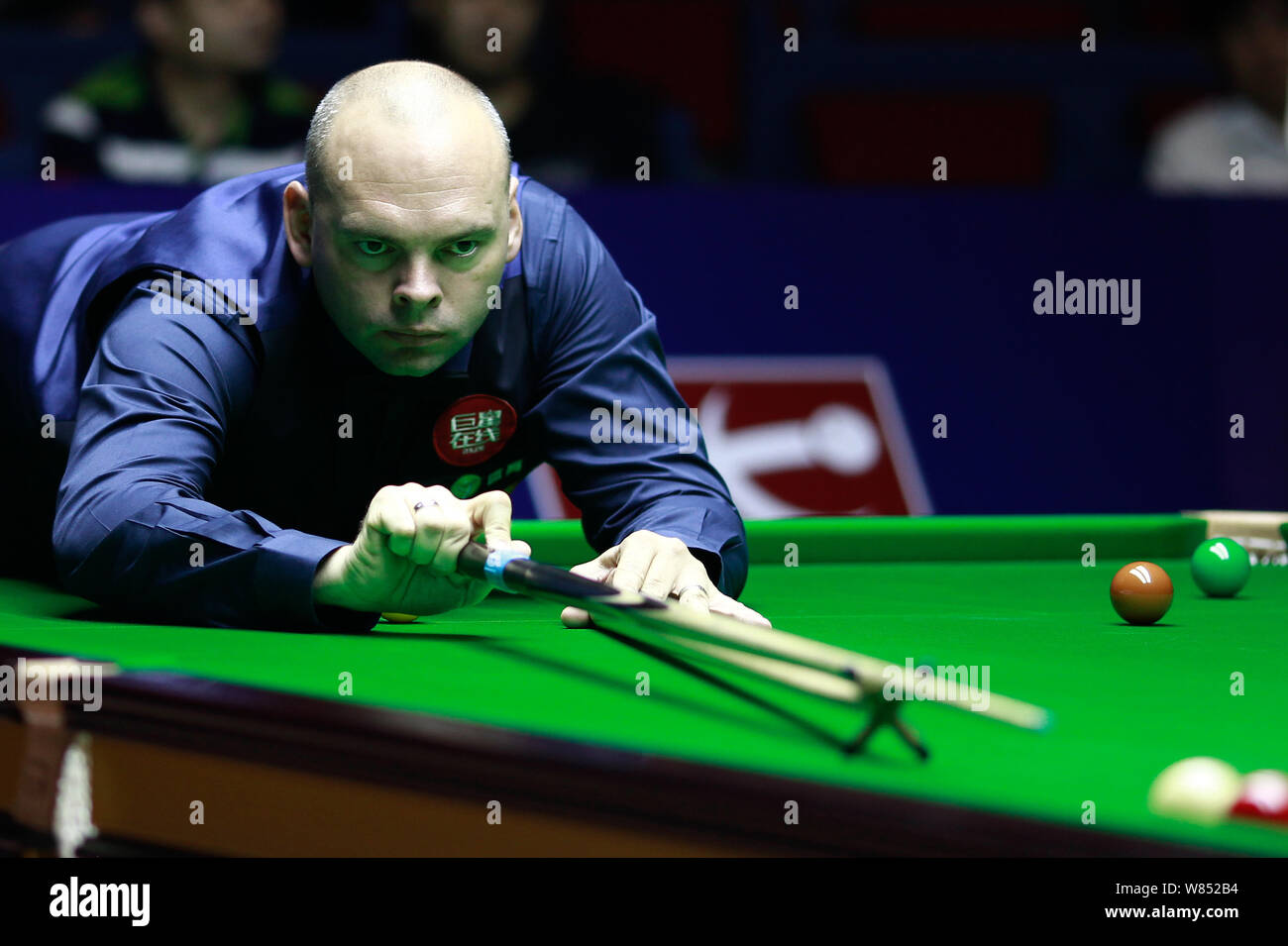 Stuart Bingham of England plays a shot against Allister Carter of ...