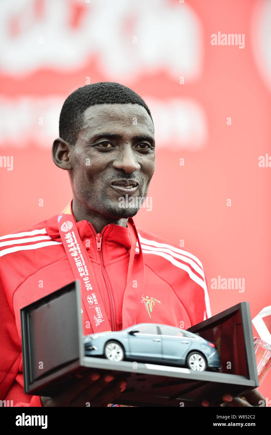 Girmay Birhanu Gebru of Ethiopia poses with his trophy after winning ...
