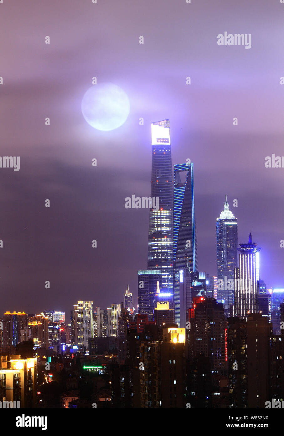 Full moon rises over the Shanghai Tower, tallest, the Shanghai World ...