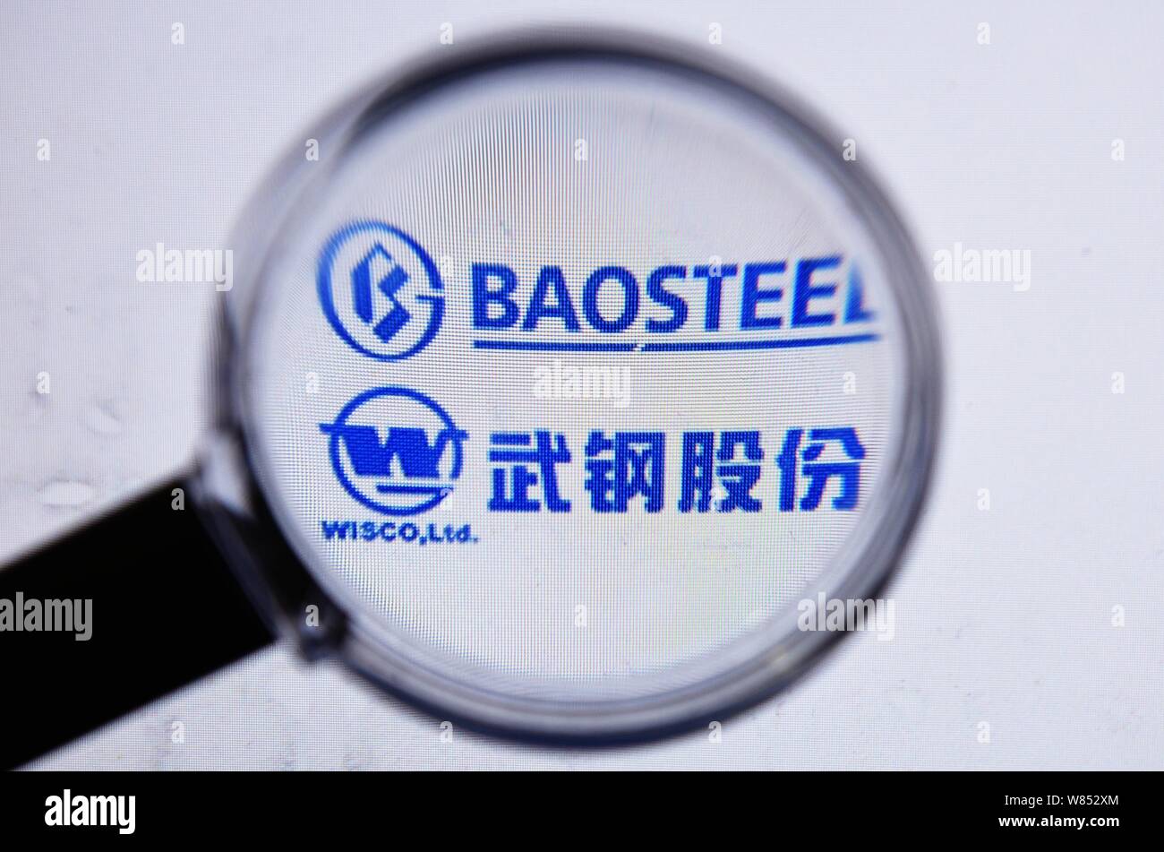 --FILE--A netizen browses an online image of the logos of Baosteel and ...