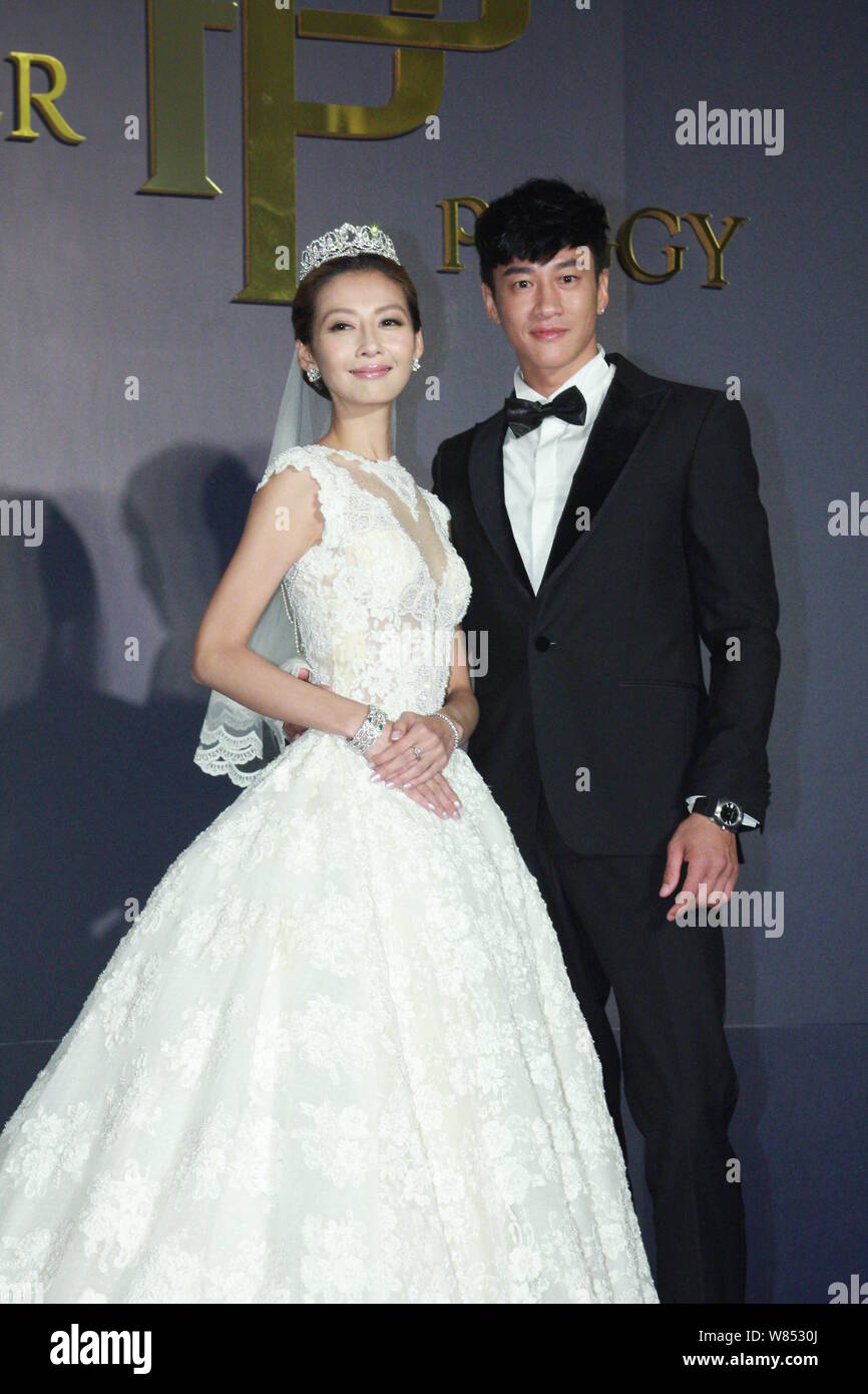 Taiwanese actor Peter Ho poses with his wife Peggy during their wedding ...