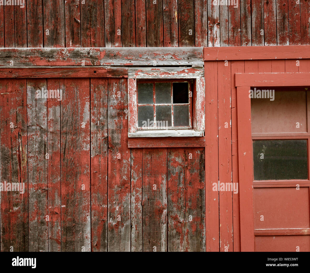Weathered red paint and broken windows are a common site on barns in ...