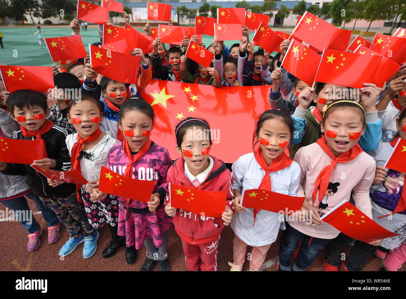 School children wave flags hi-res stock photography and images - Alamy
