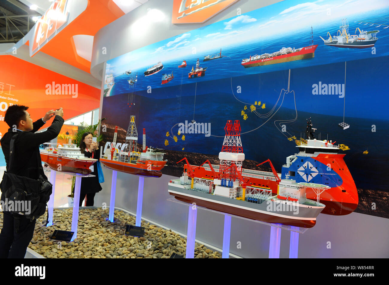 --FILE--Visitors take photos at the stand of China State Shipbuilding ...